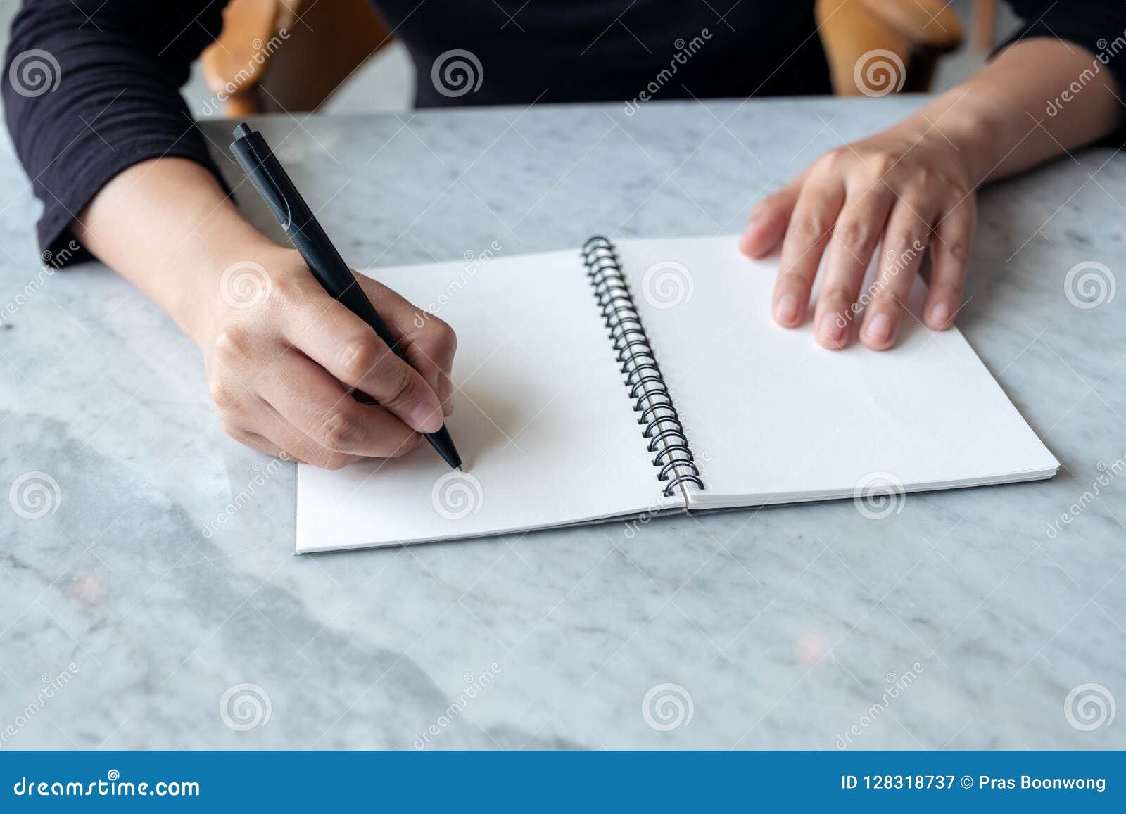 Hands Writing on Blank Notebook on the Table Stock Image - Image of ...