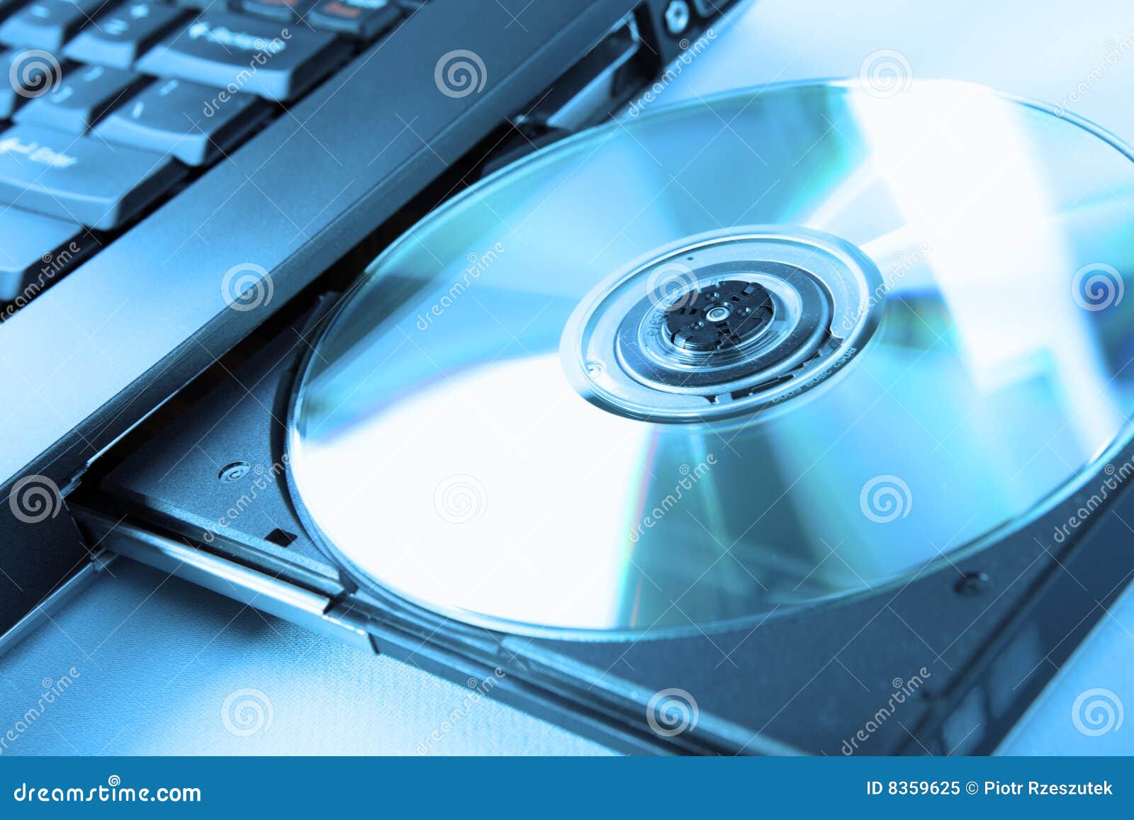 Closeup Image of a Laptop and a CD / DVD Disc Stock Image - Image of ...