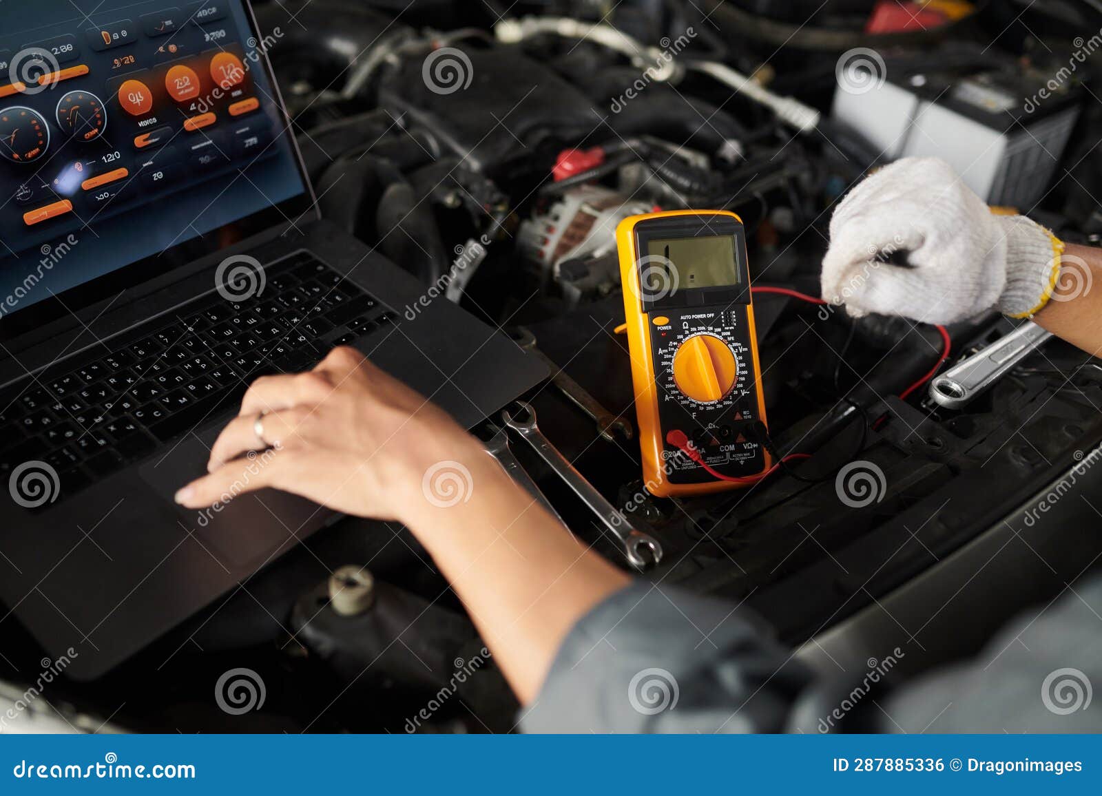 Mechanic Using Multimeter stock photo. Image of program - 287885336