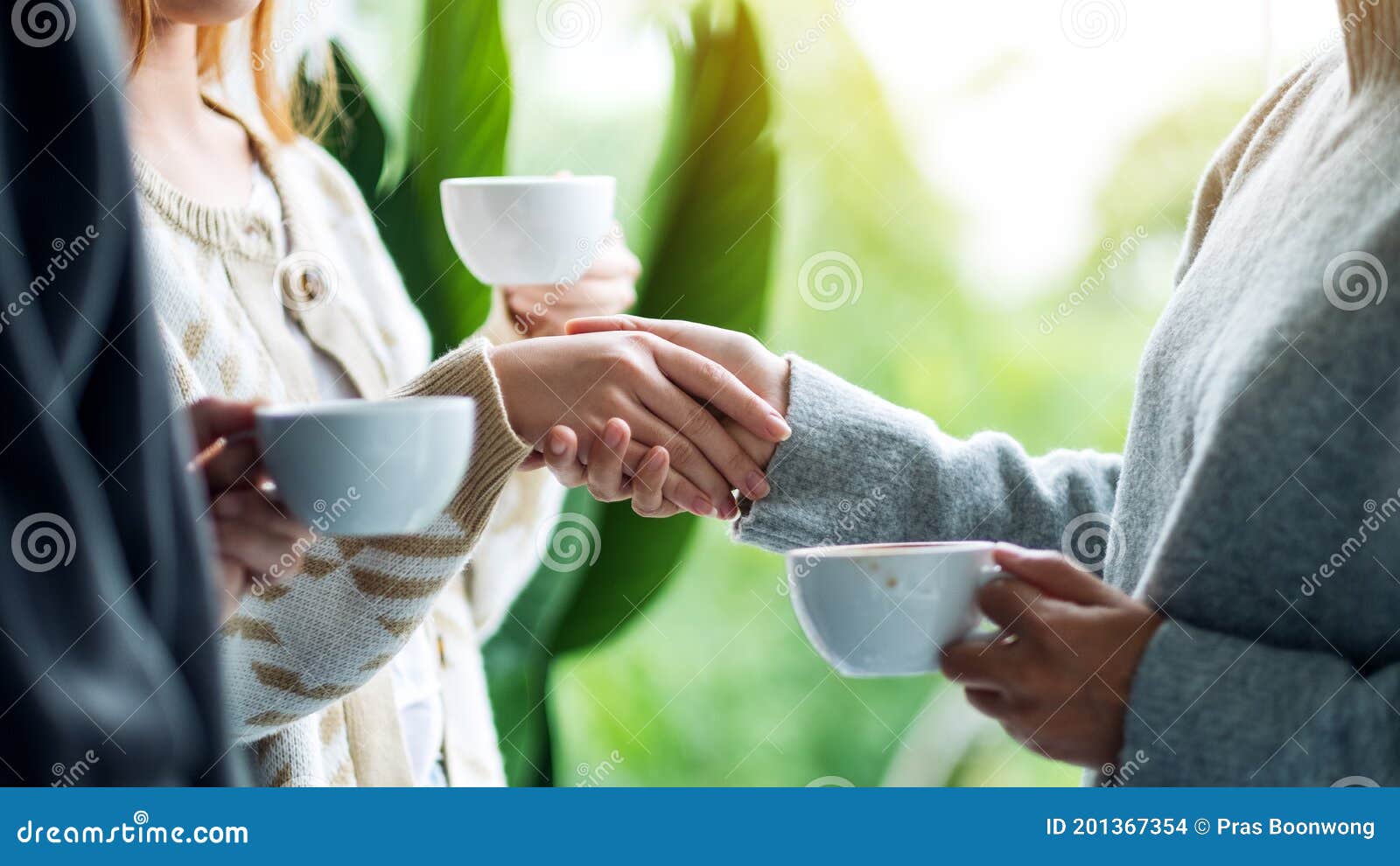 People Holding Hands while Drinking Coffee Together Stock Photo - Image ...