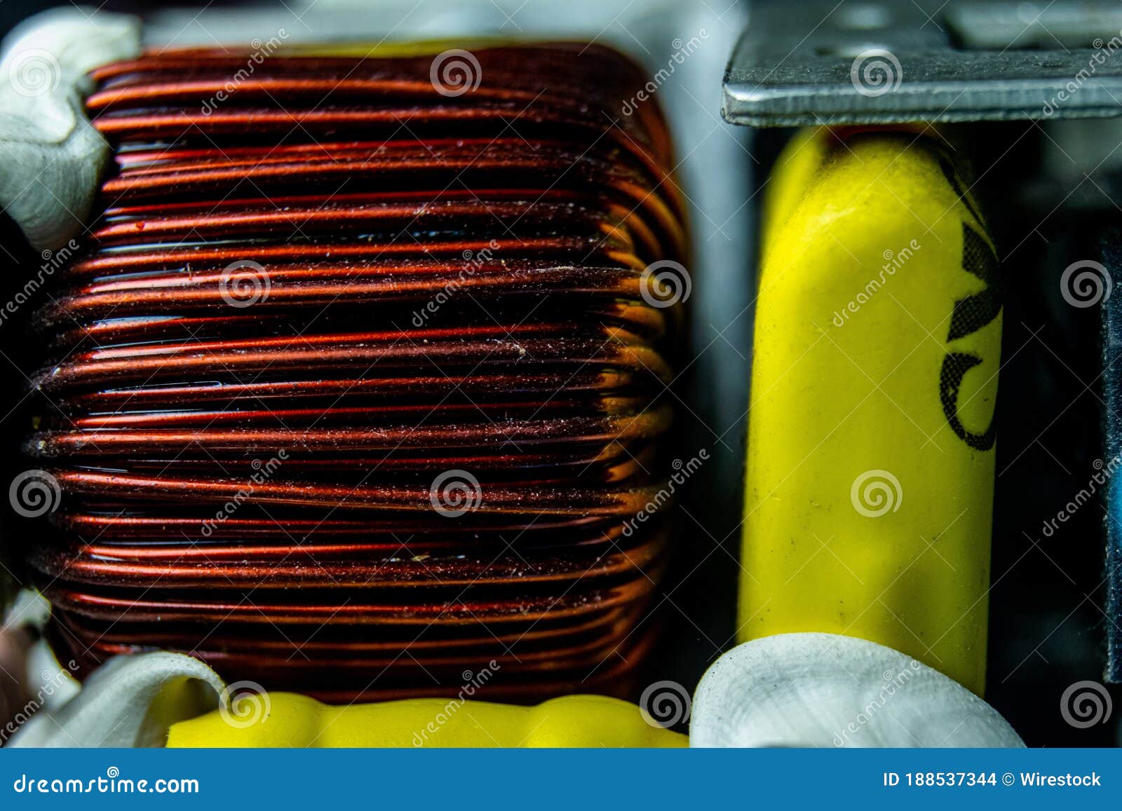 Closeup of the Inductor of a Computer Under the Lights with a Blurry ...