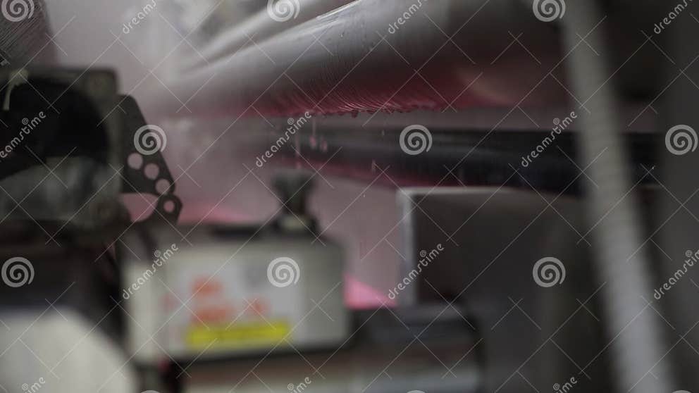 Closeup of Industrial Machine with Fluid Drips in Action, Showcasing ...