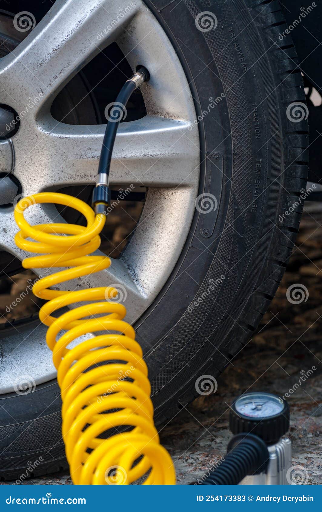 Closeup of Inflating Car Tyre with Electric Pump. Stock Image - Image ...