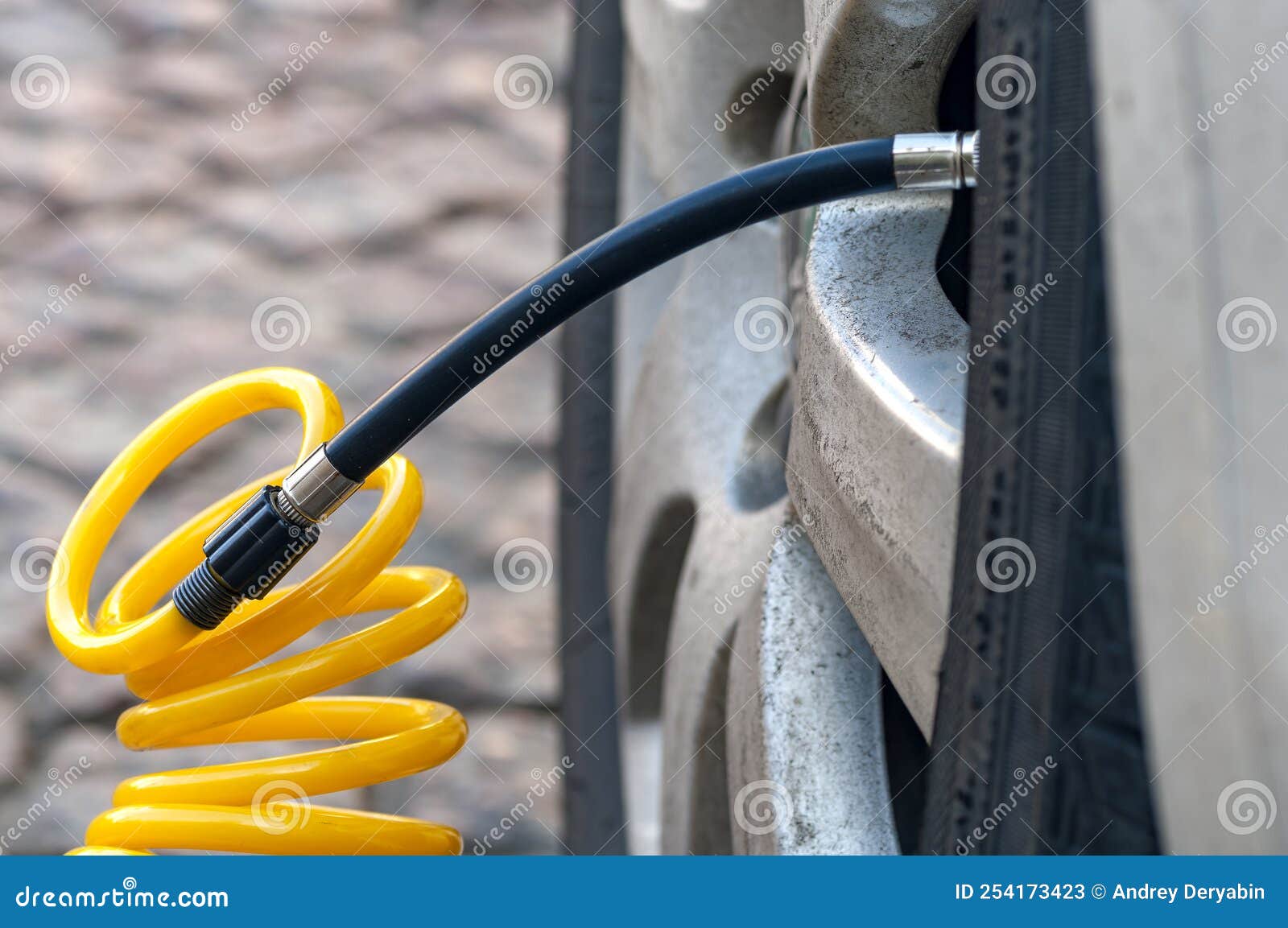 Closeup of Inflating Car Tyre with Electric Pump Stock Image - Image of ...