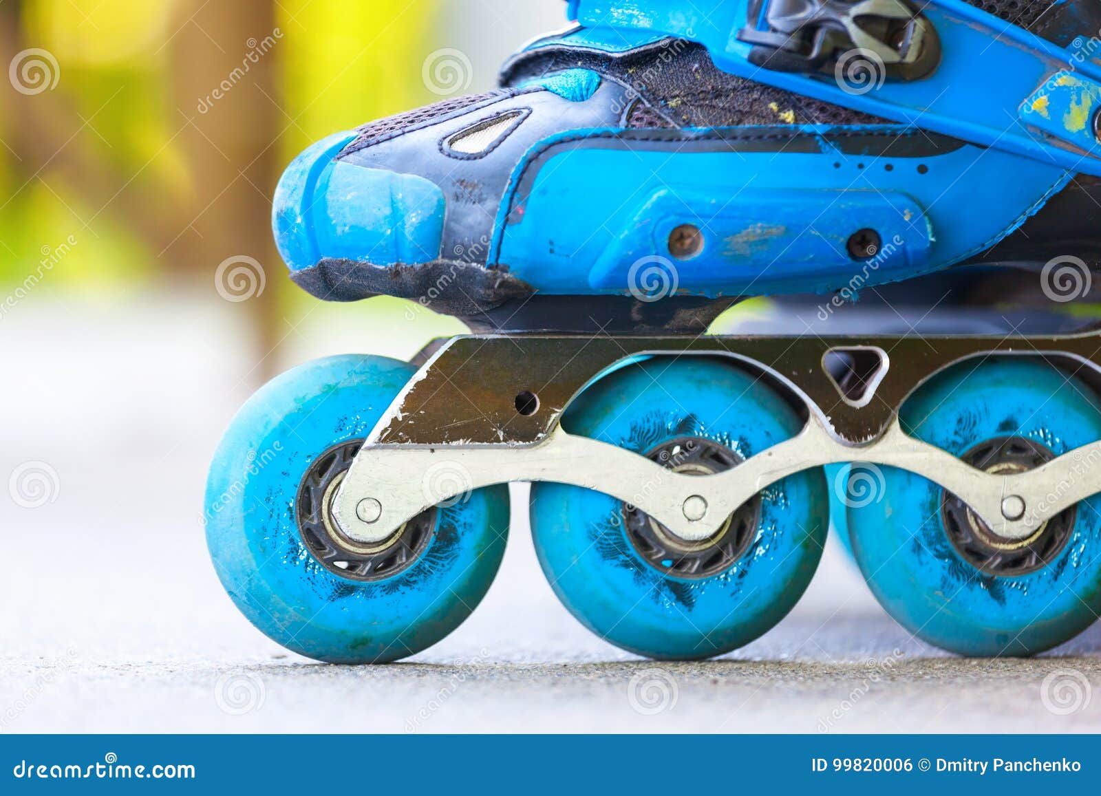 Closeup of Inline Roller Skates with Blue Wheels. Stock Photo - Image ...