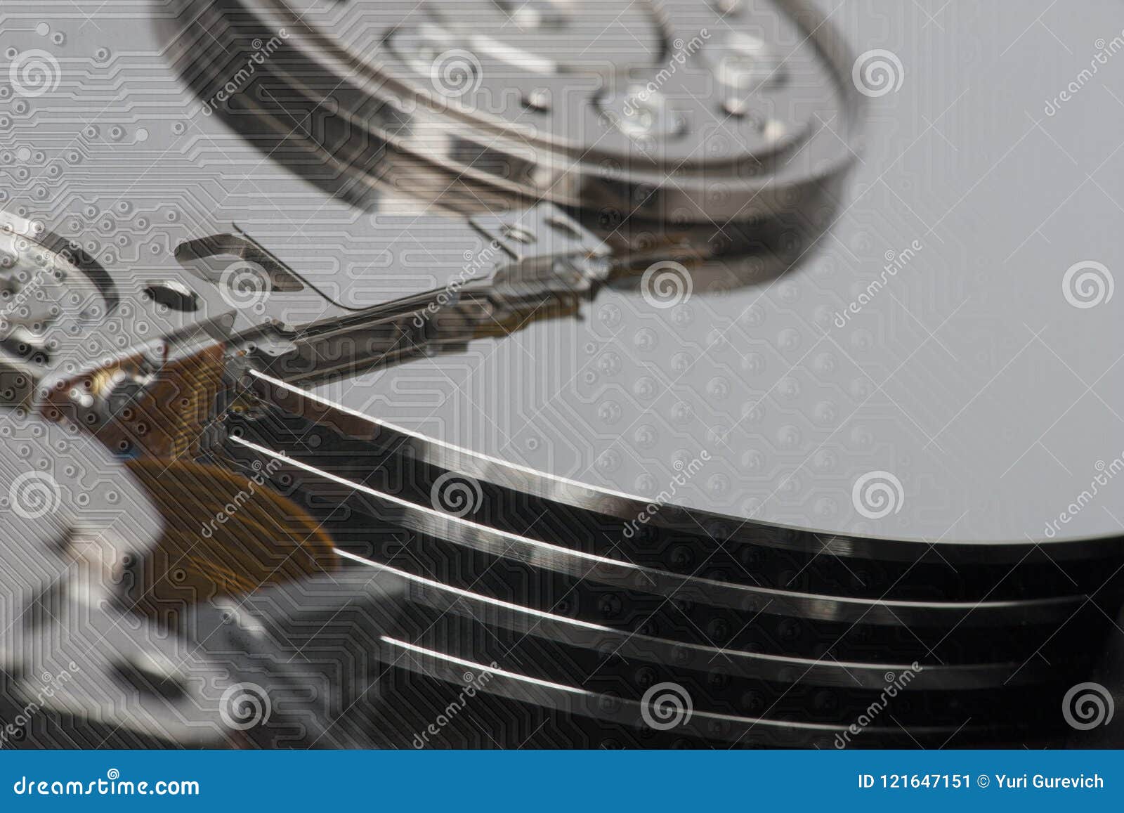 Closeup Inside a Hard Drive with an Overlaying Image of an Electronic ...