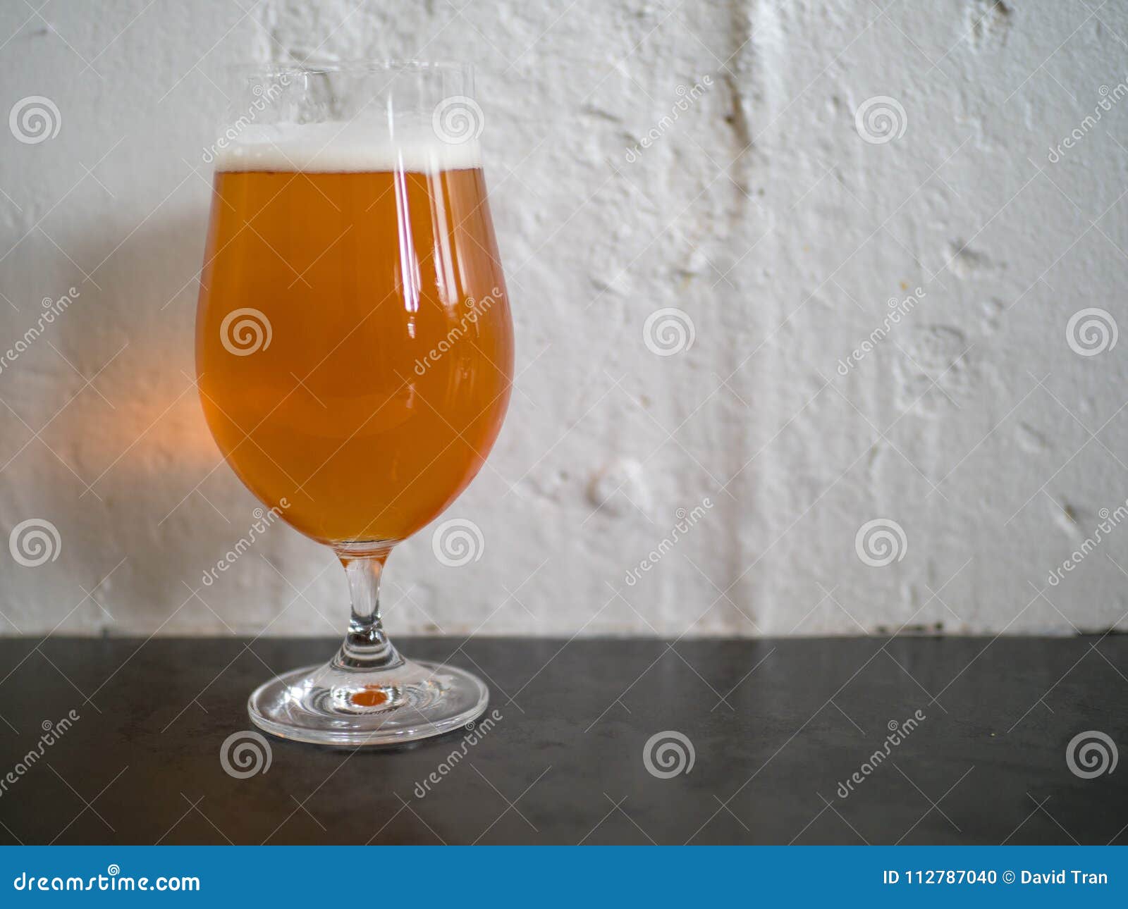 Closeup of IPA Beer in a Glass Stock Photo - Image of froth, yellow ...