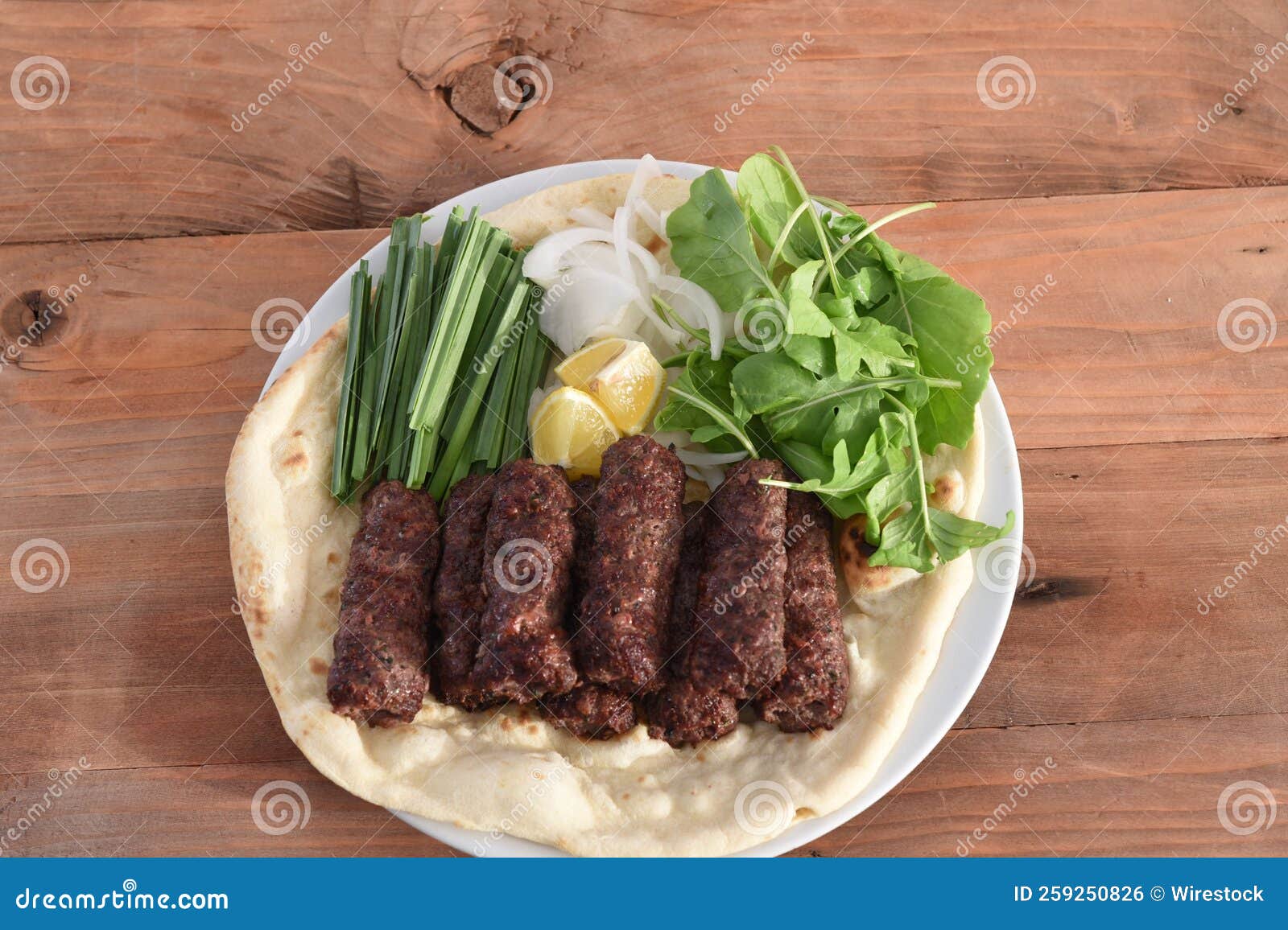 Closeup of Kebab with Fresh Herbs on a Chapati Bread Stock Photo ...