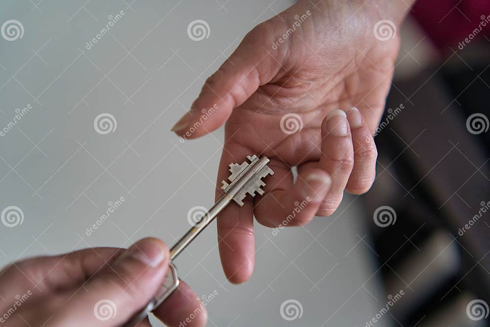 Closeup of a Key Exchange between Two People Stock Image - Image of ...