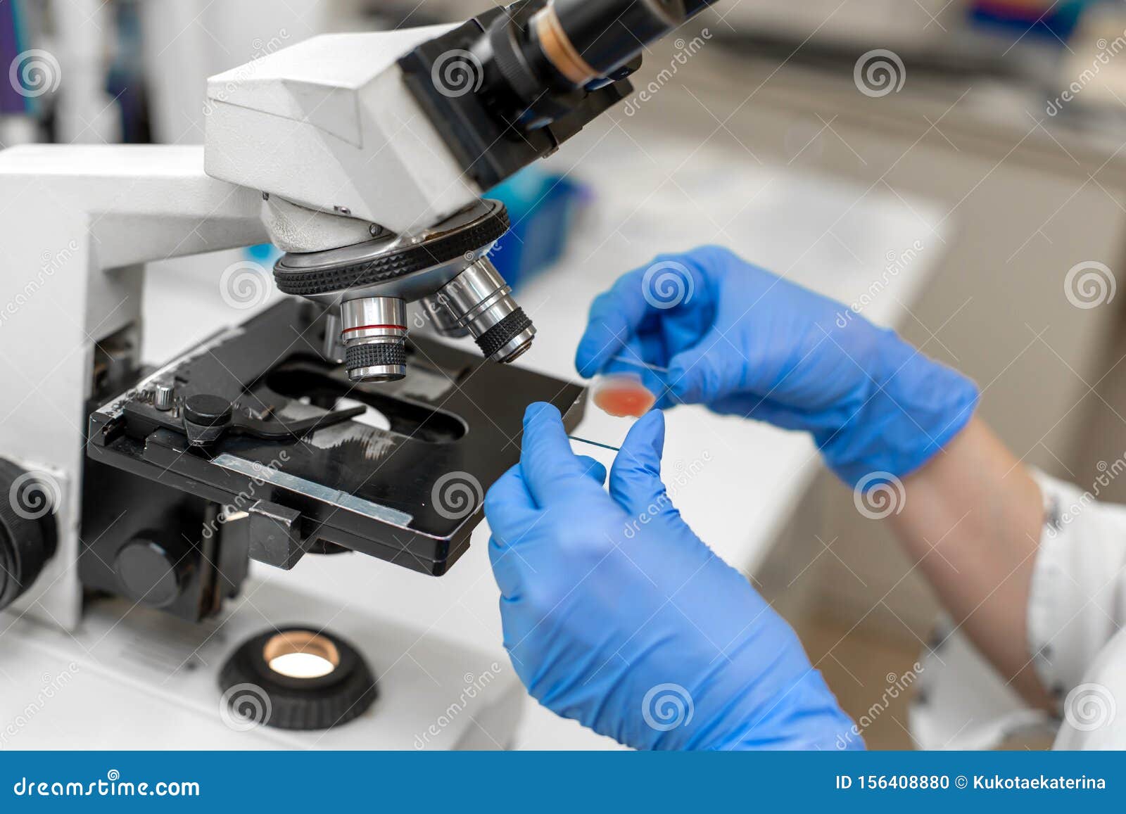 Close Up Lab Technician Research Blood Sample in Microscope Stock Photo ...