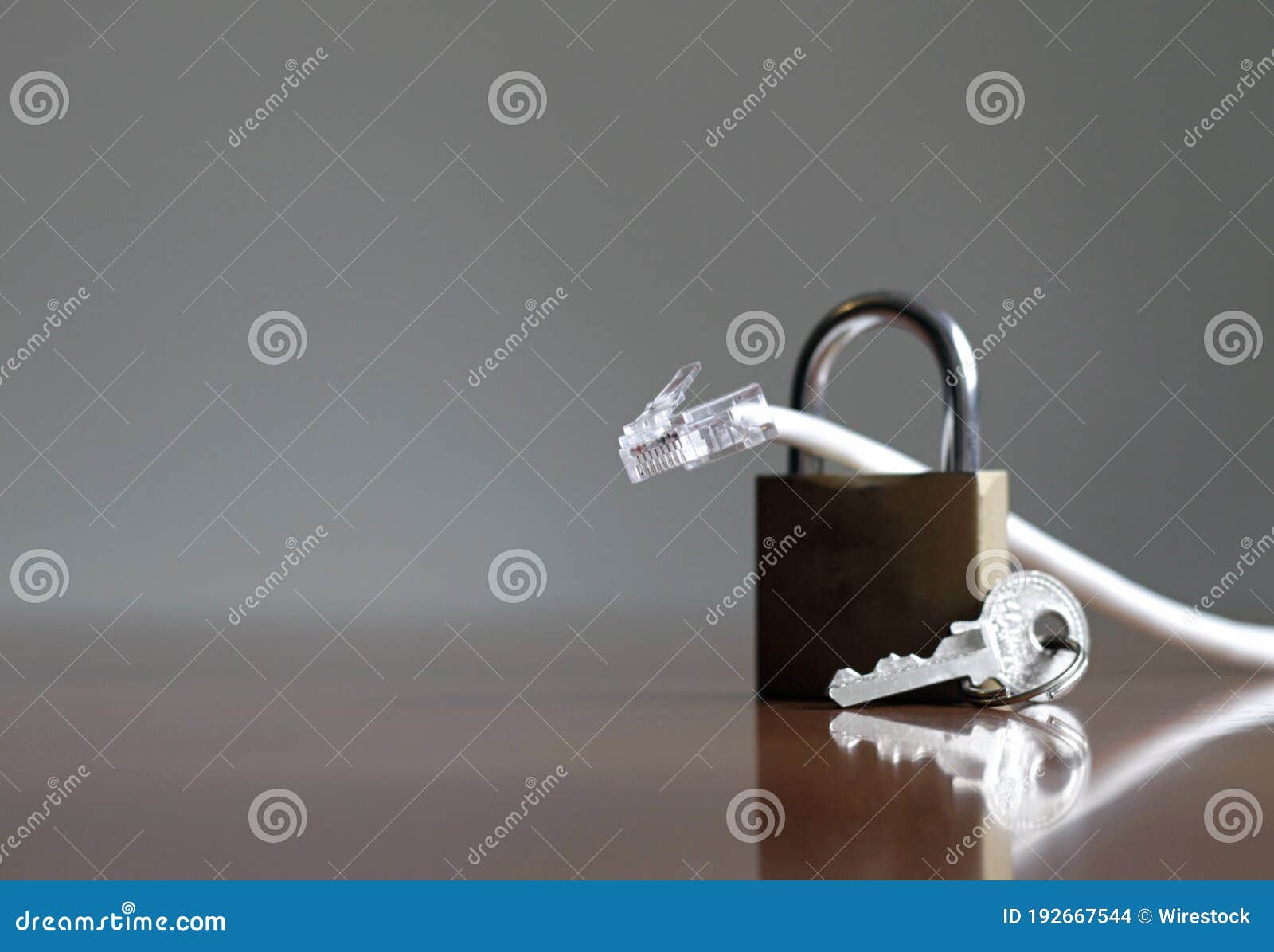 Closeup of a LAN Cable in a Padlock with a Key on the Table - Concept ...