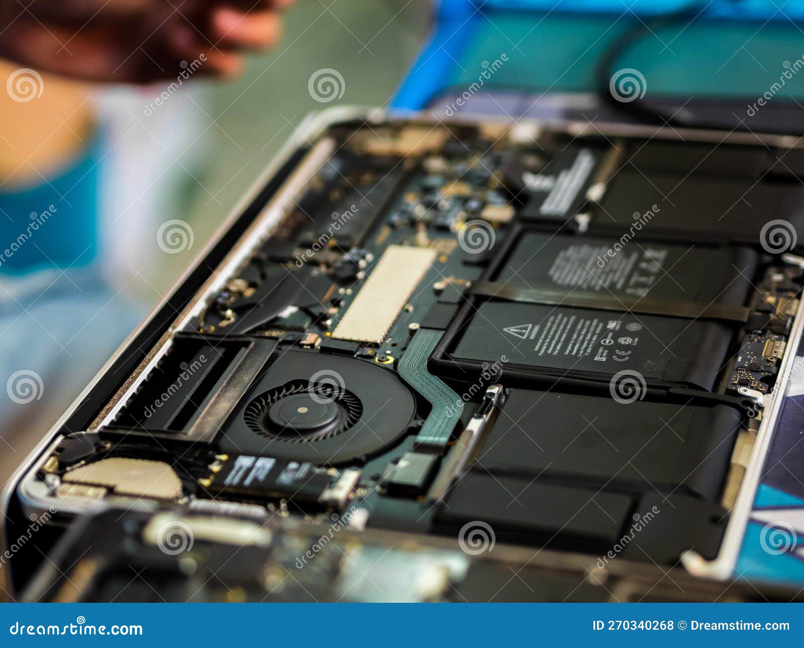Closeup of Laptop Cooling Fan, Battery, and Chip. Opened Dusty Notebook ...