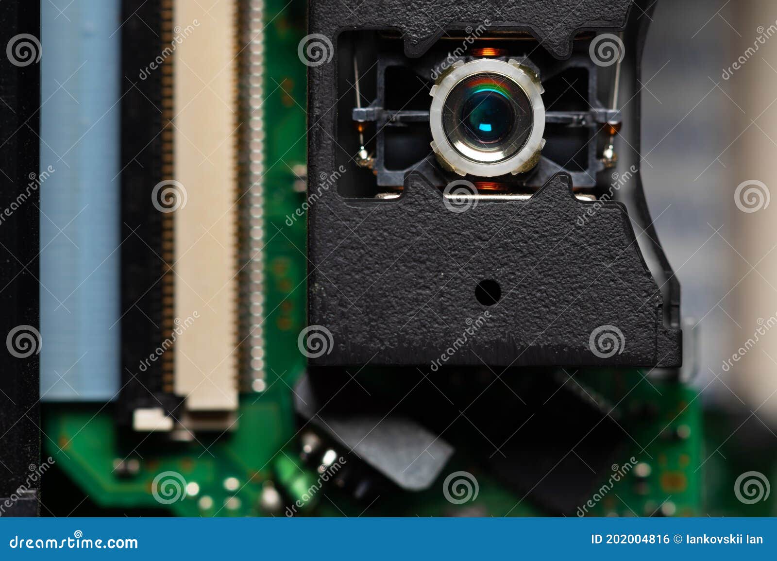 Closeup of a Laser Head and Dvd Rom Drive with Boards. Writing and ...