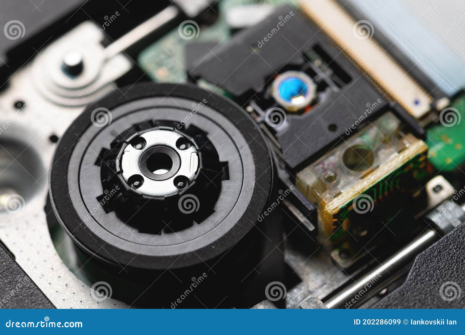 Closeup of a Laser Head and Dvd Rom Drive with Boards. Writing and ...