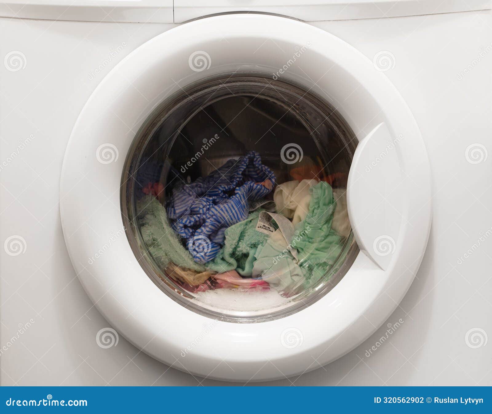 Closeup of Laundry Spinning in Washing Machine Stock Photo - Image of ...