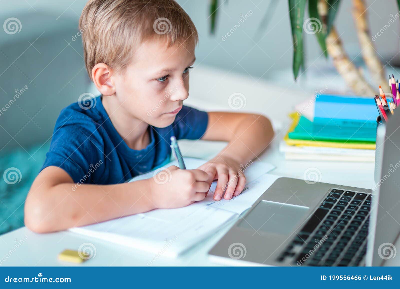 Closeup of Little Young School Boy Working at Home with a Laptop and ...