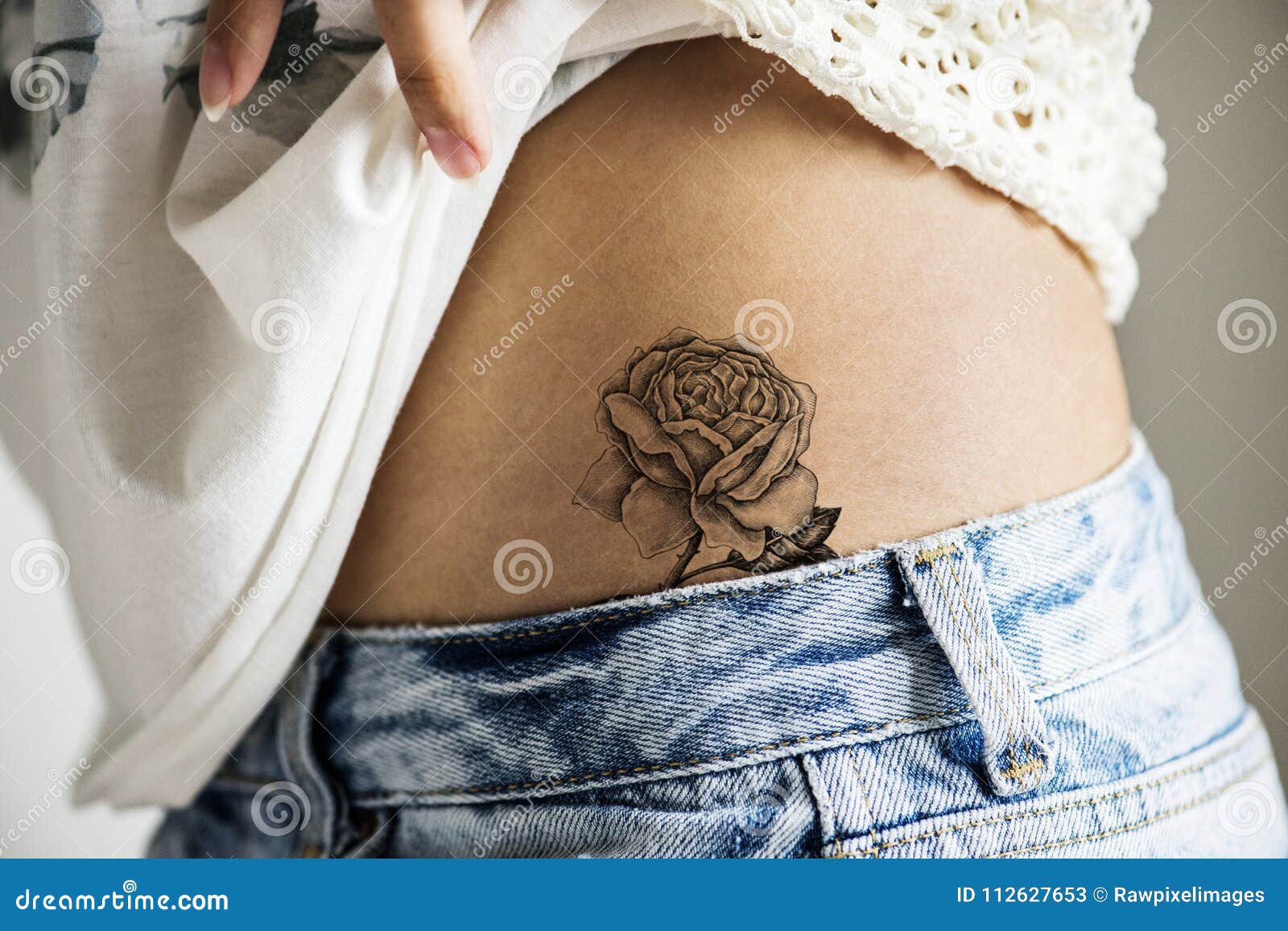 Closeup of Lower Hip Tattoo of a Woman Stock Image - Image of design ...