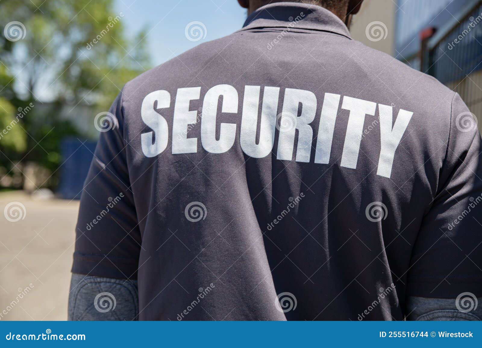 Closeup of a Man S Back in Uniform with "Security" Writing Stock Photo ...