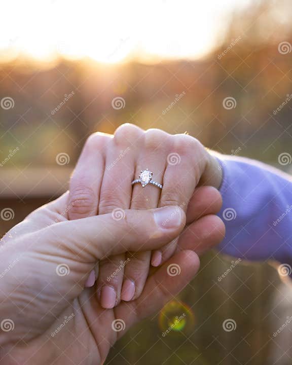 Closeup of the Man S Hand Holding the Girl S Hand with a Ring. Stock ... Closeup of the Man S Hand Holding the Girl S Hand with a Ring. Stock ...