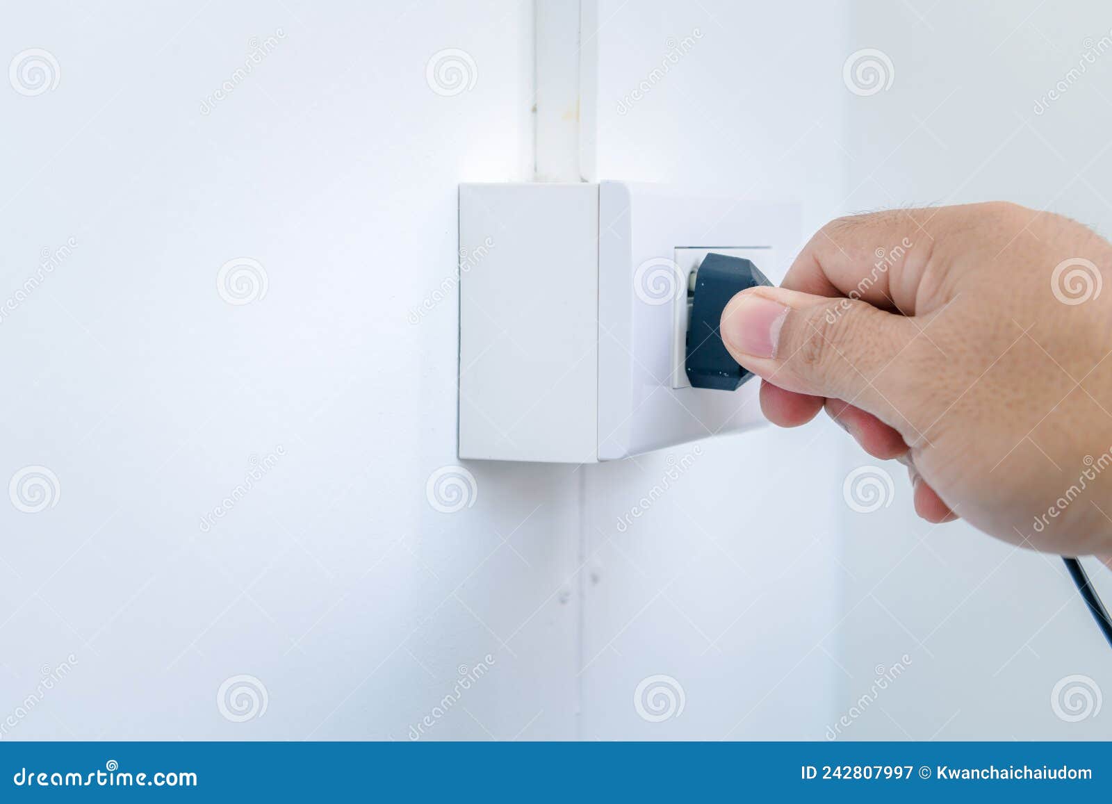 Closeup of a Man`s Hand Inserting an Electrical Plug into Socket Stock ...