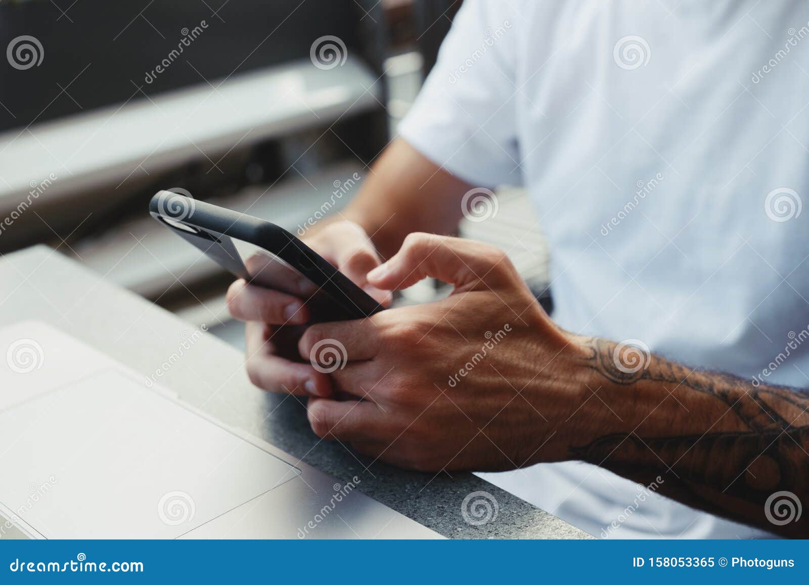 Closeup of a Man`s Hands is Holding Smartphone and Typing Text Message ...