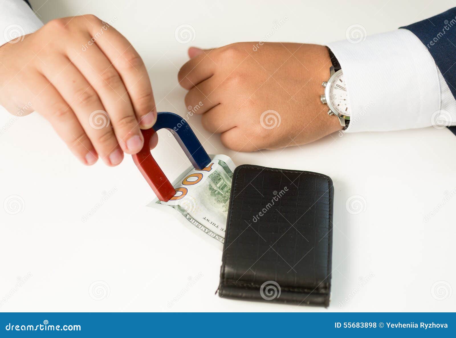 Closeup of Man in Suit Pulling Money Out Wallet with Magnet Stock Photo ...