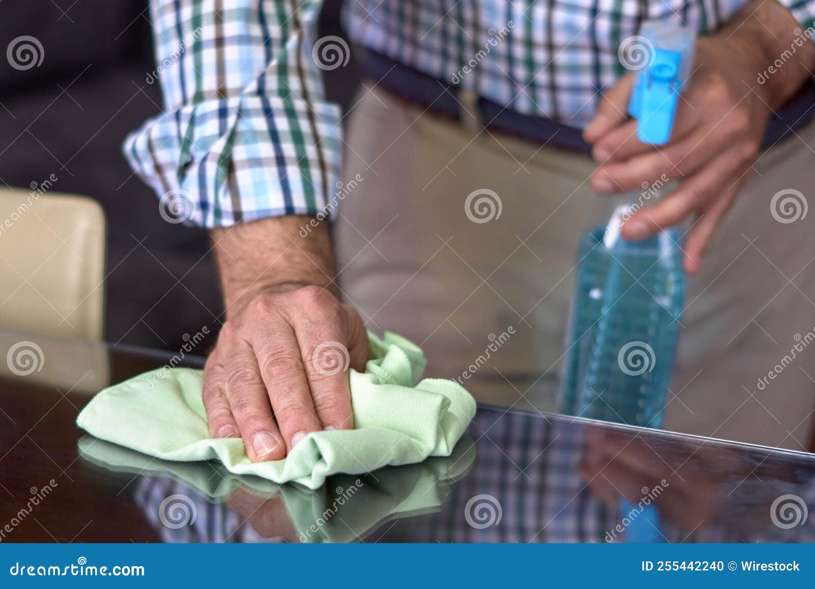Closeup of a Man Wiping a Glass Surface with a Cloth Stock Photo ...