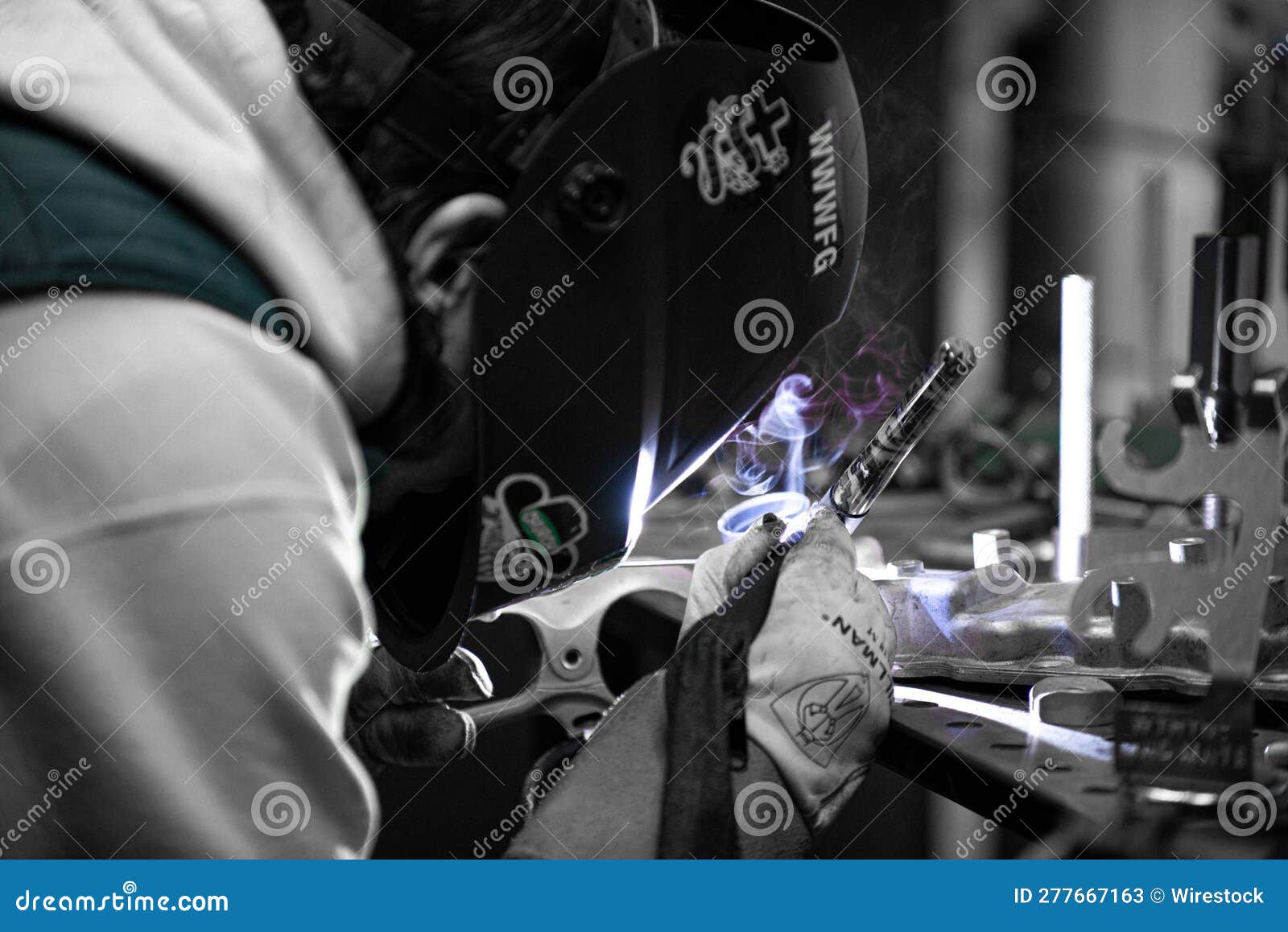 Closeup of a Master Welding Tig in the Garage with a Blurry Background ...