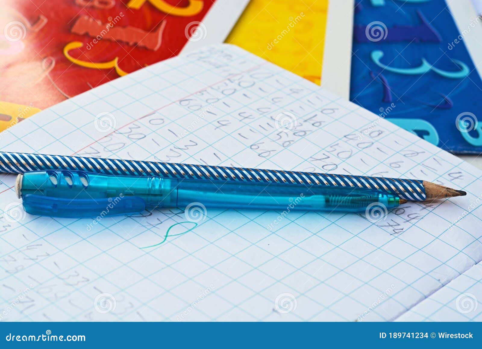 Closeup Math Exercises Written in a Textbook with a Pen and Pencil on ...