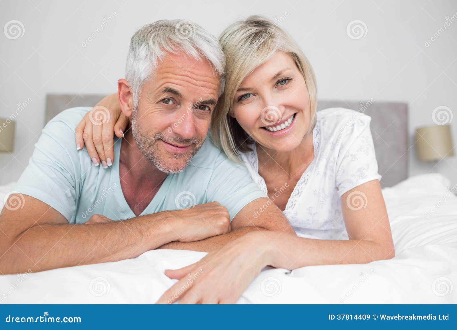 Closeup of a Mature Couple Lying in Bed Stock Image - Image of house ...