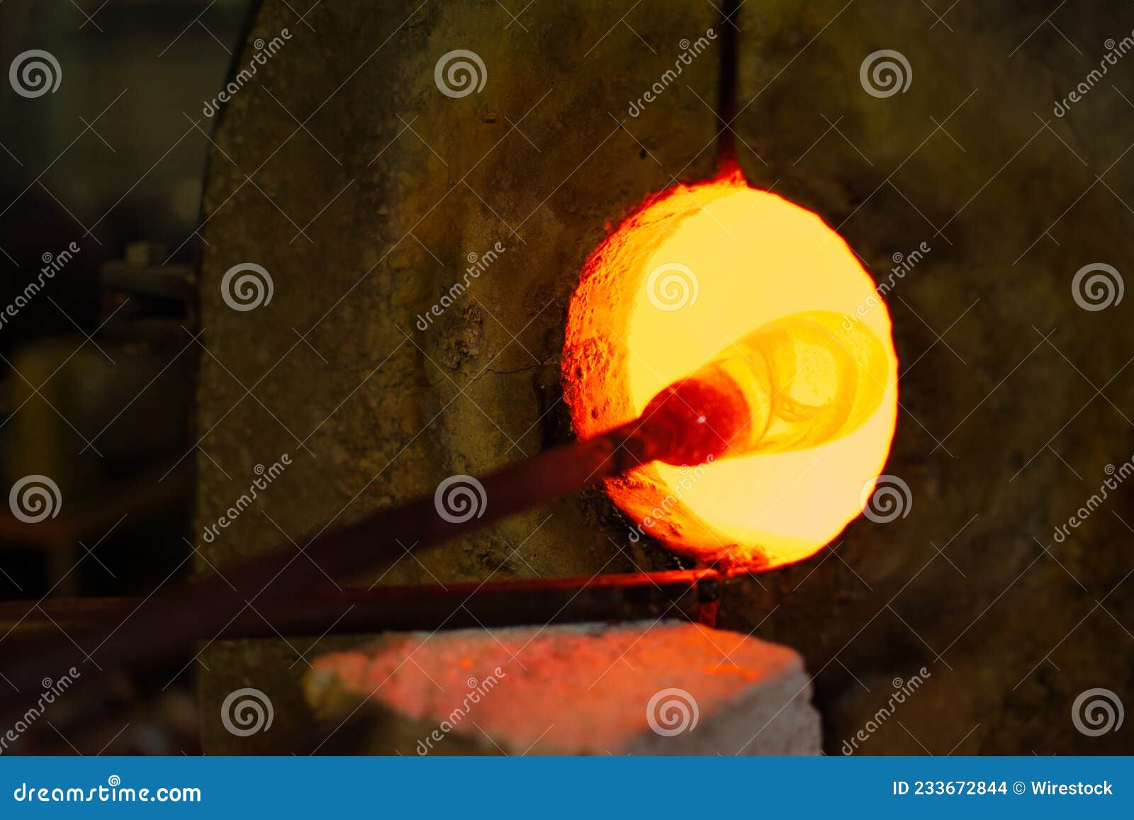 Closeup of Melting Glass in a Workshop with a Dark Blurry Background ...