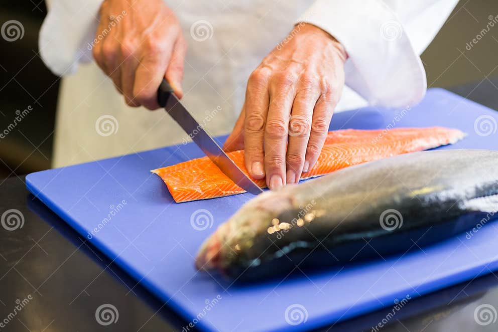 Closeup Mid Section of a Chef Cutting Fish Stock Photo - Image of ...