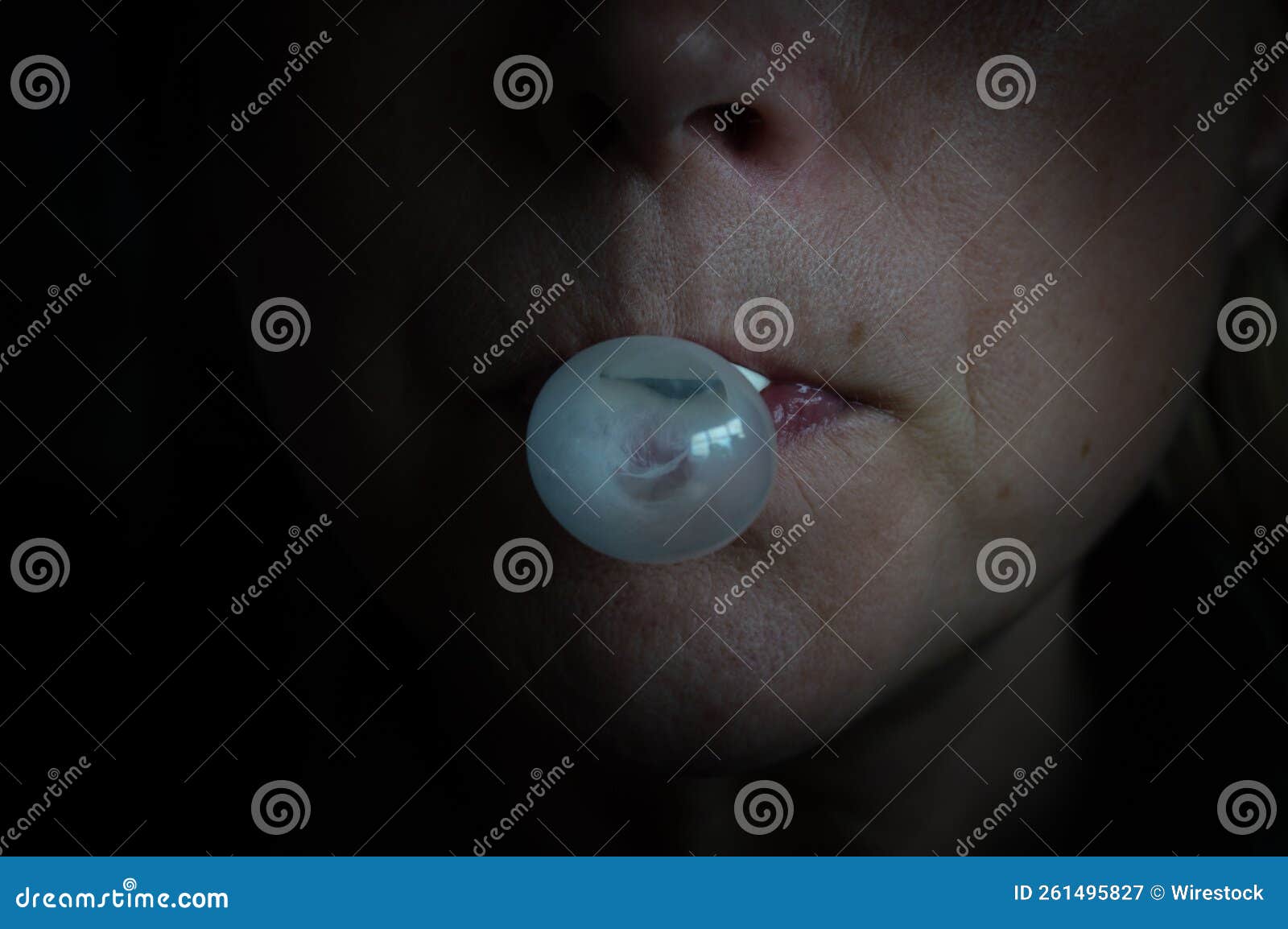 Closeup of a Middle-aged Female Face Blowing Bubble Gum Stock Image ...