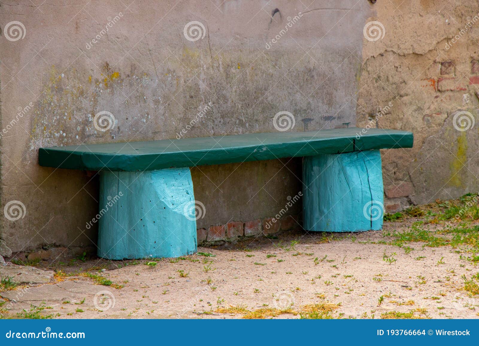 Closeup of a Mint Green Bench Made from a Tree Near the Wall Stock ...