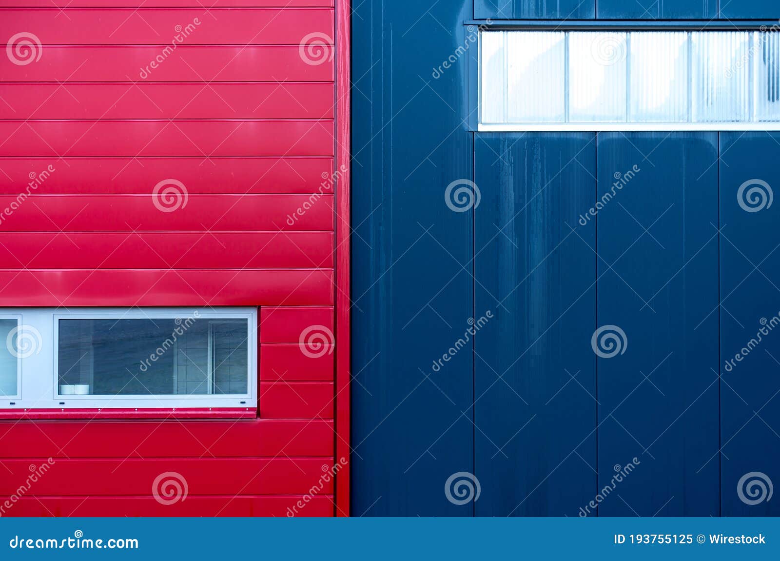 Closeup of a Modern Building with Red and Blue Walls Under the Lights ...