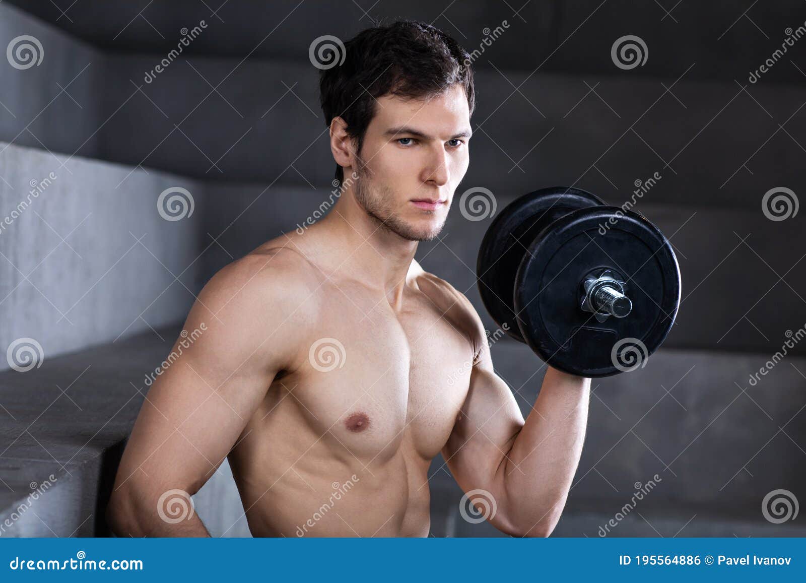 Closeup of a Muscular Young Man with Dumbbell Stock Photo - Image of ...
