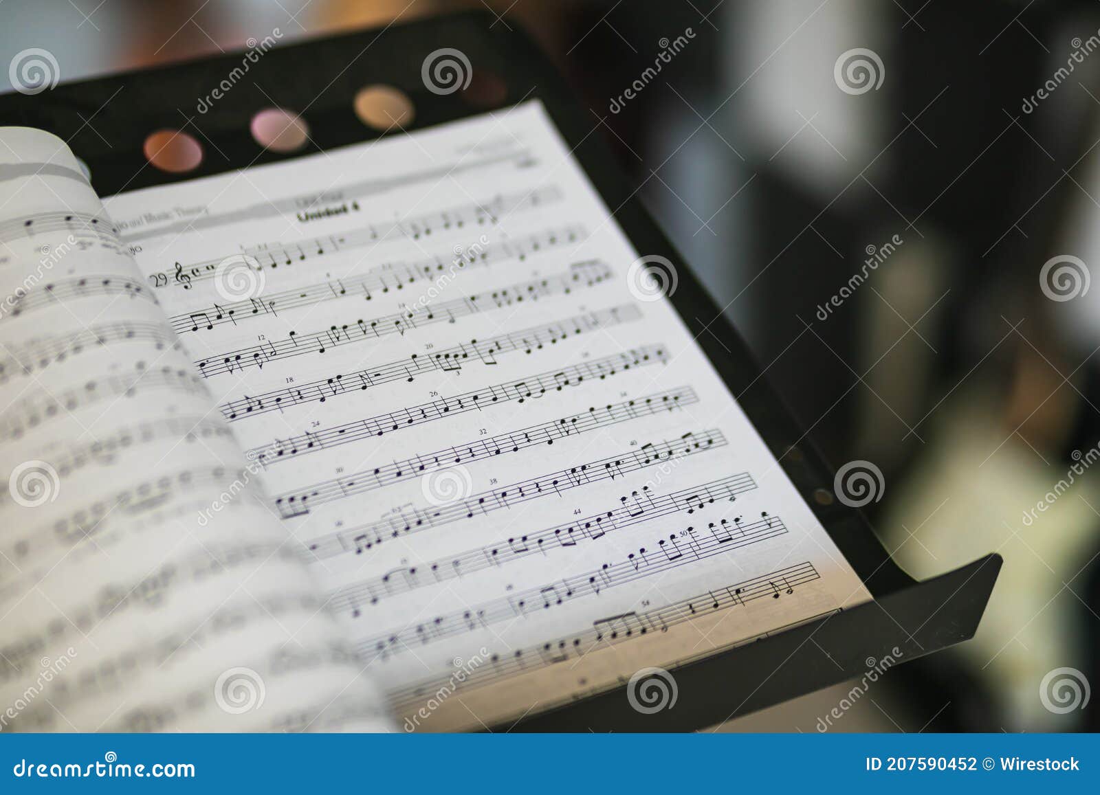 Closeup of Music Note Sheets on a Stand with a Blurry Backgr Stock ...