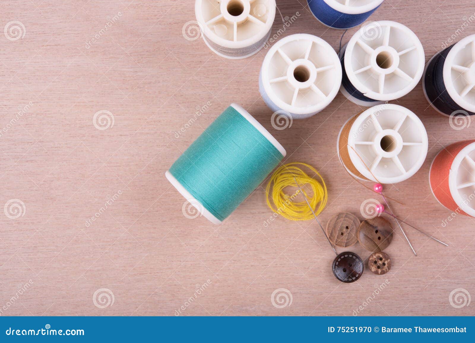 Closeup Needles, Thread Spool, Scissors, Button on Wooden Stock Photo ...