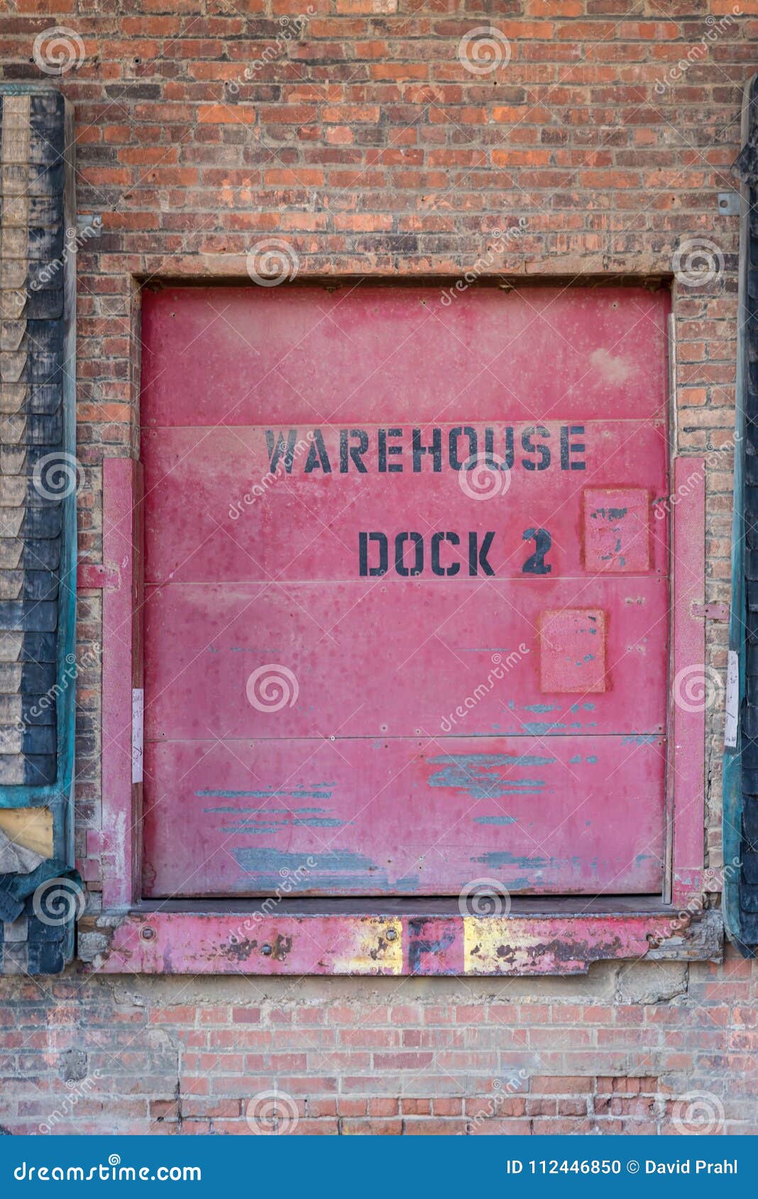 Closeup of Old Red Warehouse Dock Door on Brick Wall Stock Photo ...