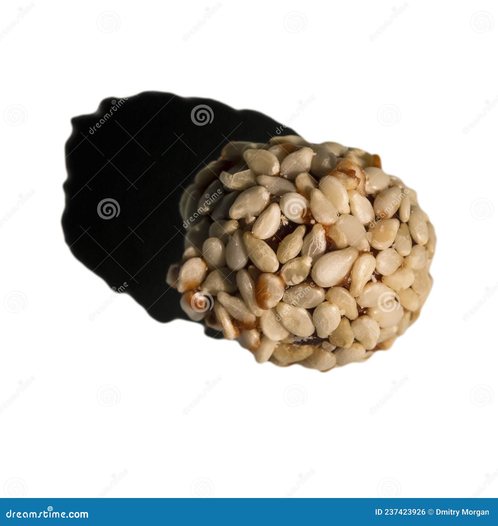 Closeup of One Separate Nut with Sesame Seeds and Hard Shadow Isolated ...