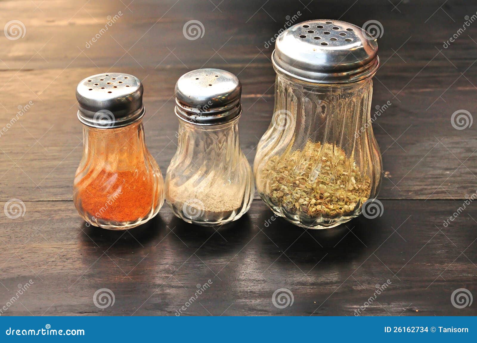 Closeup of Oregano, Pepper and Chilli Bottles on W Stock Photo - Image ...