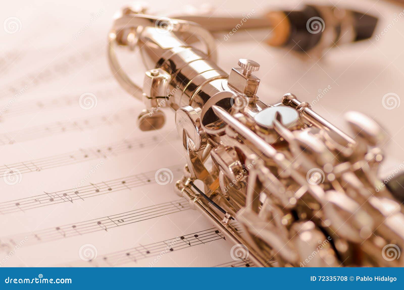 Closeup Partly View of Shiny Saxophone Lying on Musical Notes Paper ...