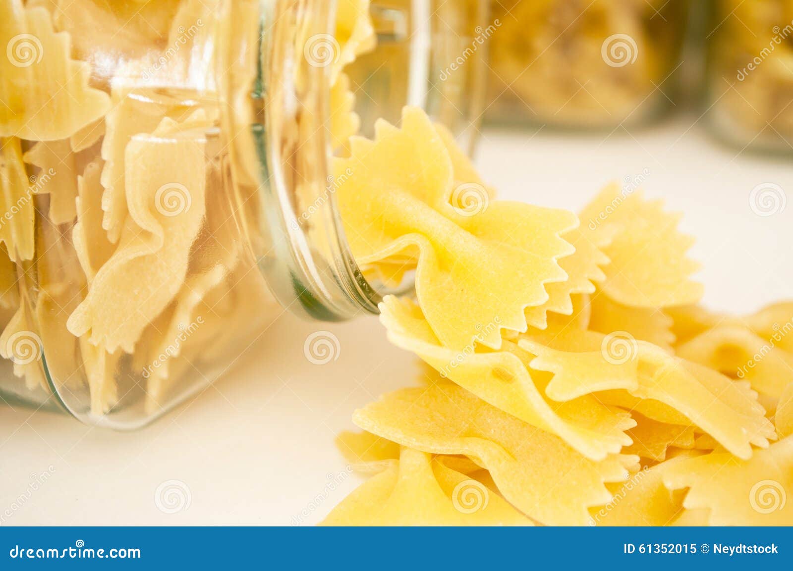 Closeup of Pasta Falling from Glass Container Stock Image - Image of ...
