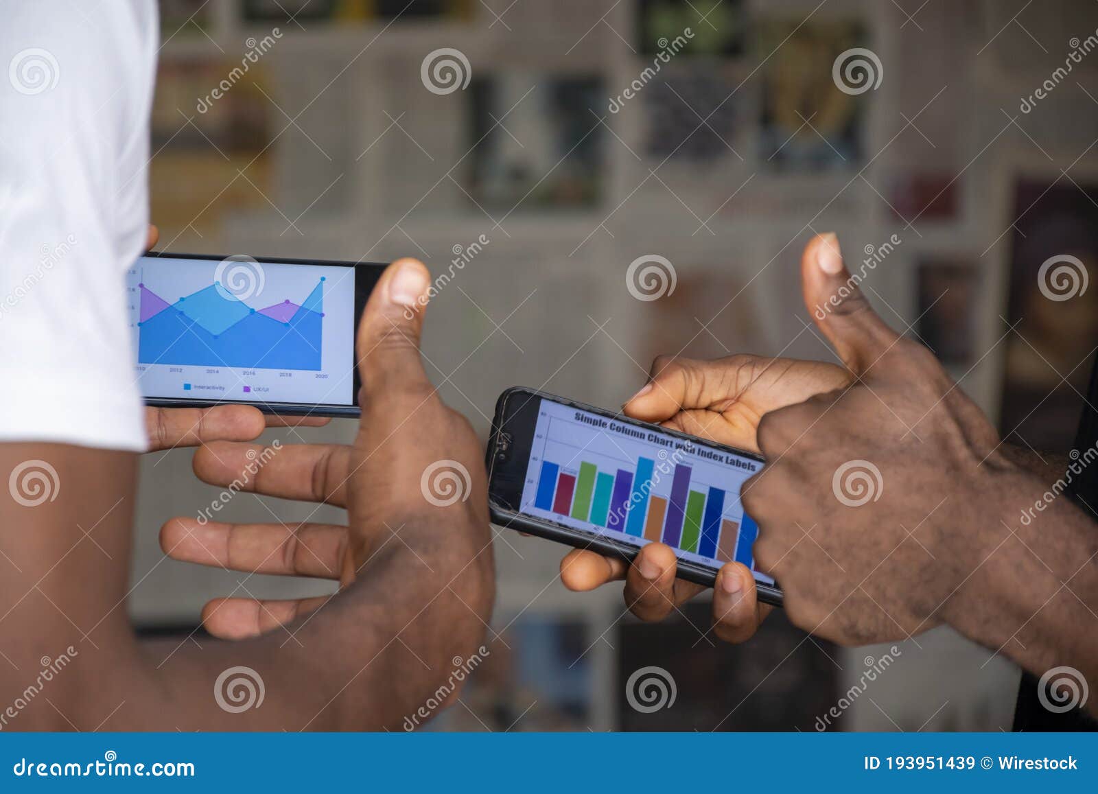 Closeup of People Comparing Different Charts on Mobile Devices - Future ...