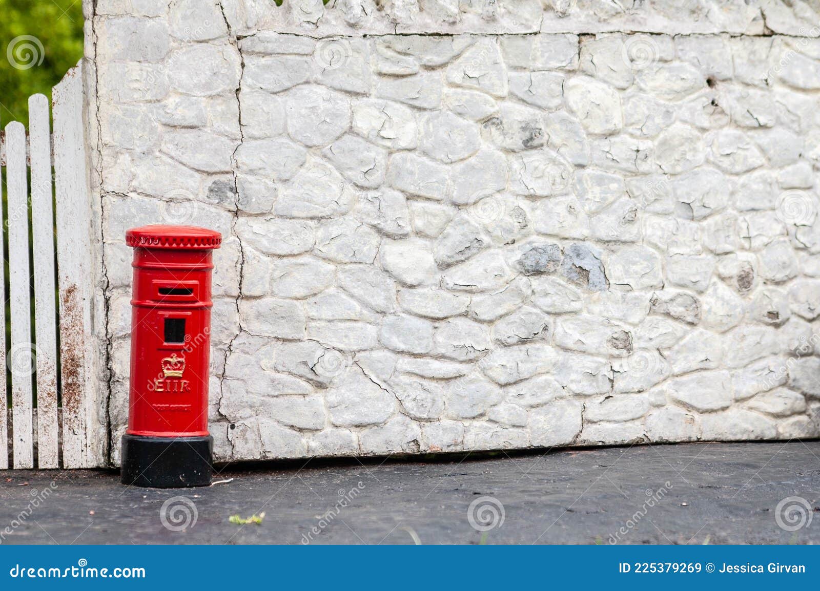 Closeup Photo of Tiny Model British Postbox Against a Stone Wall ...