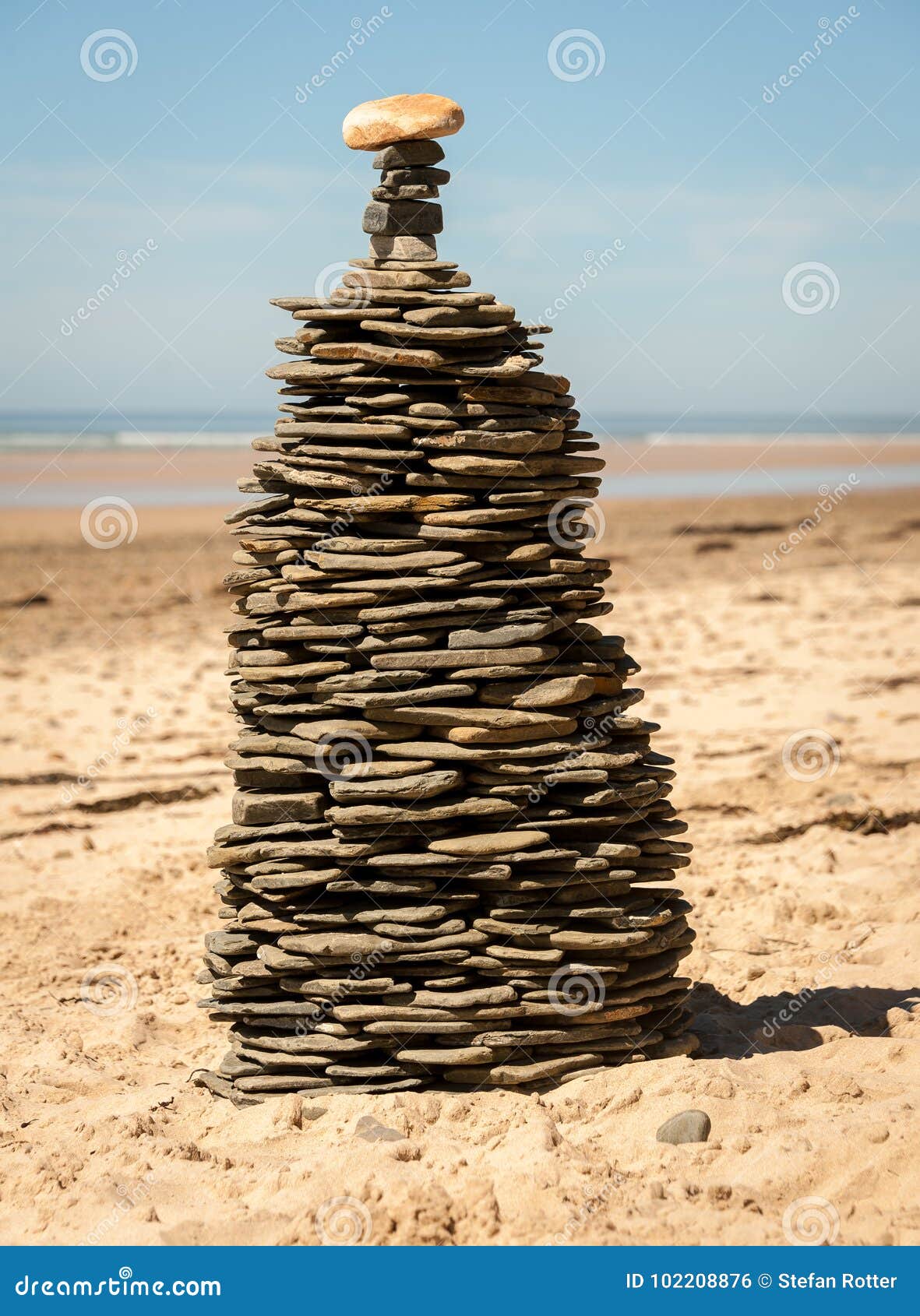 A Pile of Stacked Pebbles on the Beach Stock Photo - Image of peaceful ...