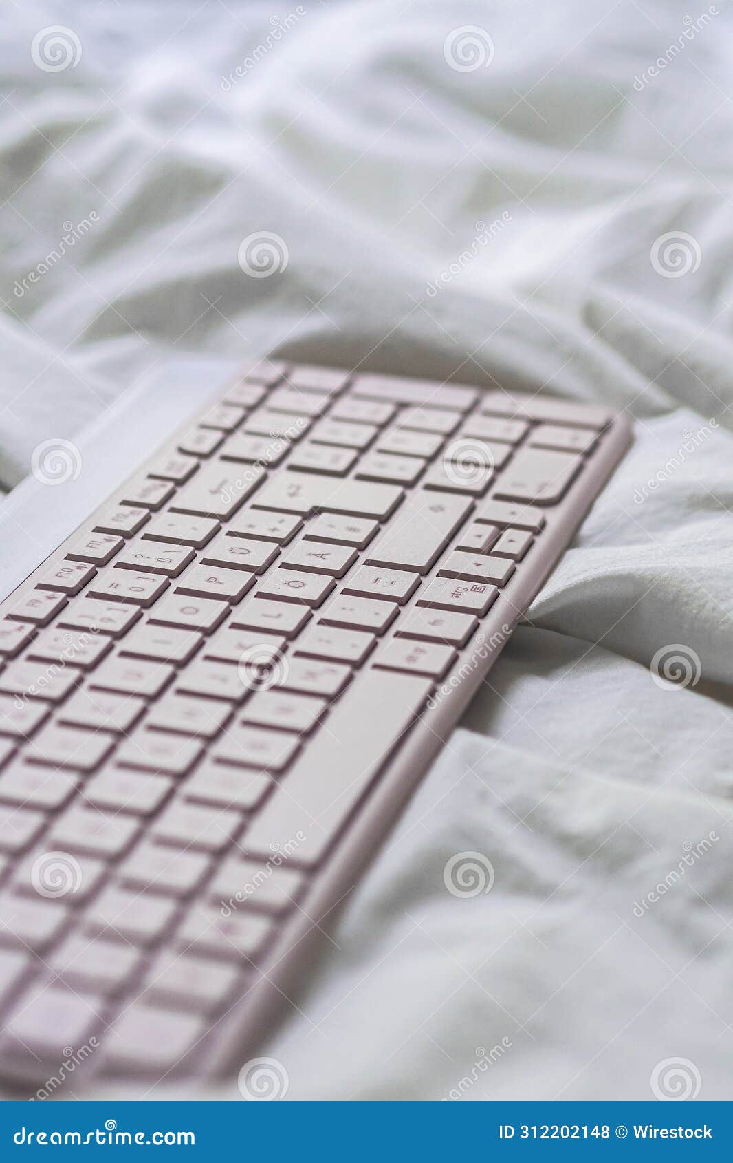 Closeup of a Pink Keyboard on a White Bed Stock Photo - Image of ...