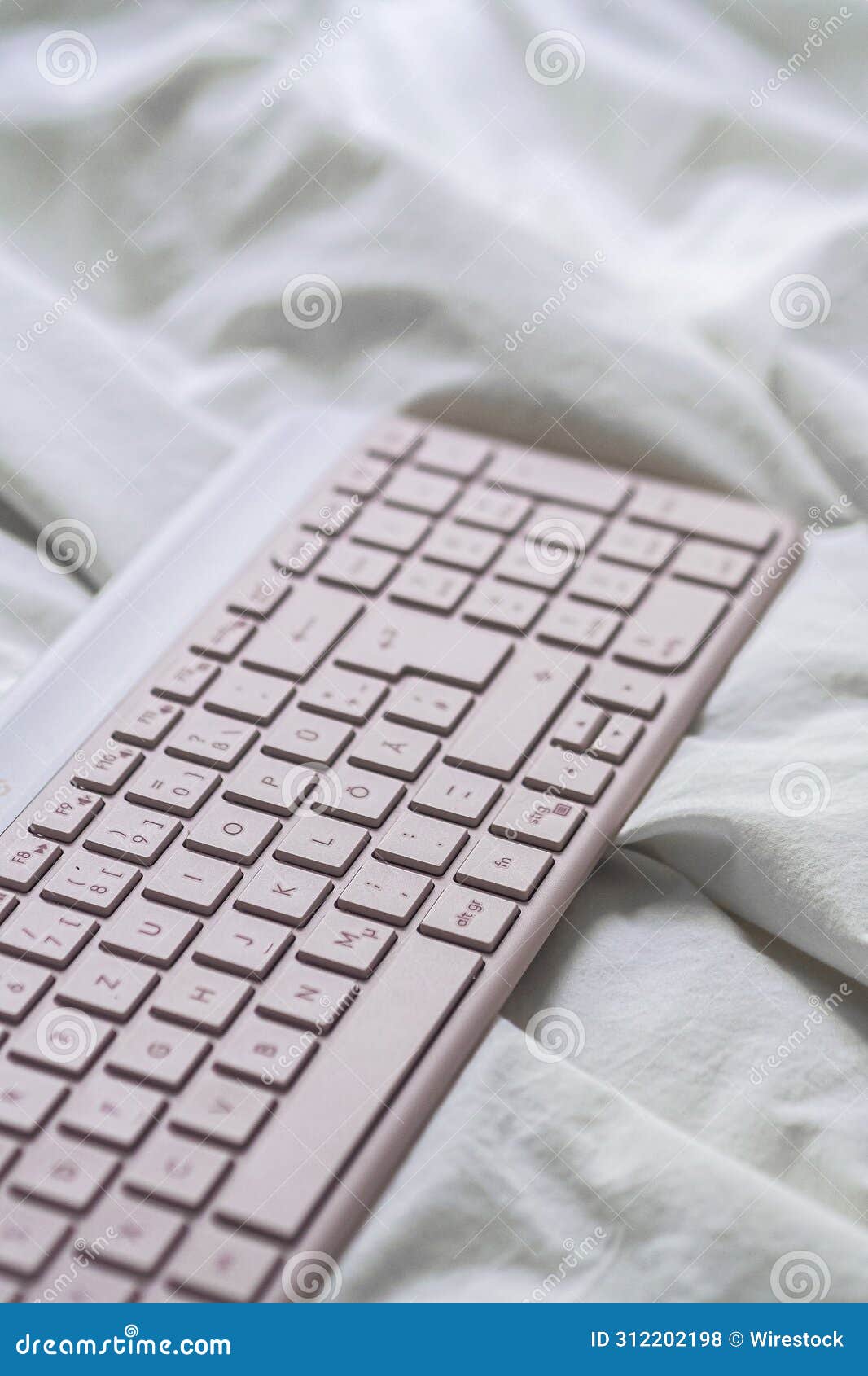 Closeup of a Pink Keyboard on a White Bed Stock Photo - Image of ...
