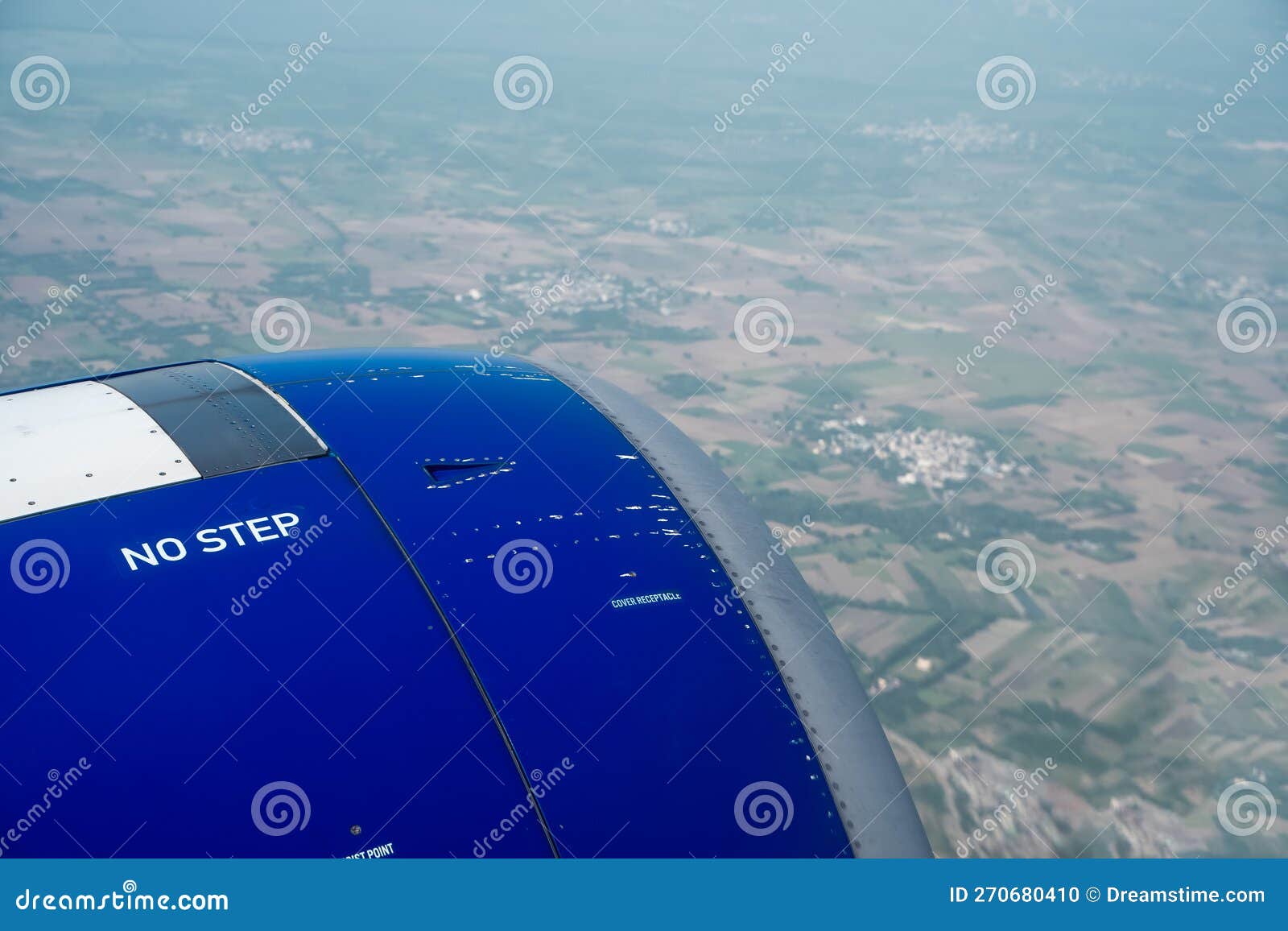 Closeup of Plane Engine Taken from Inside the Airplane. City View from ...