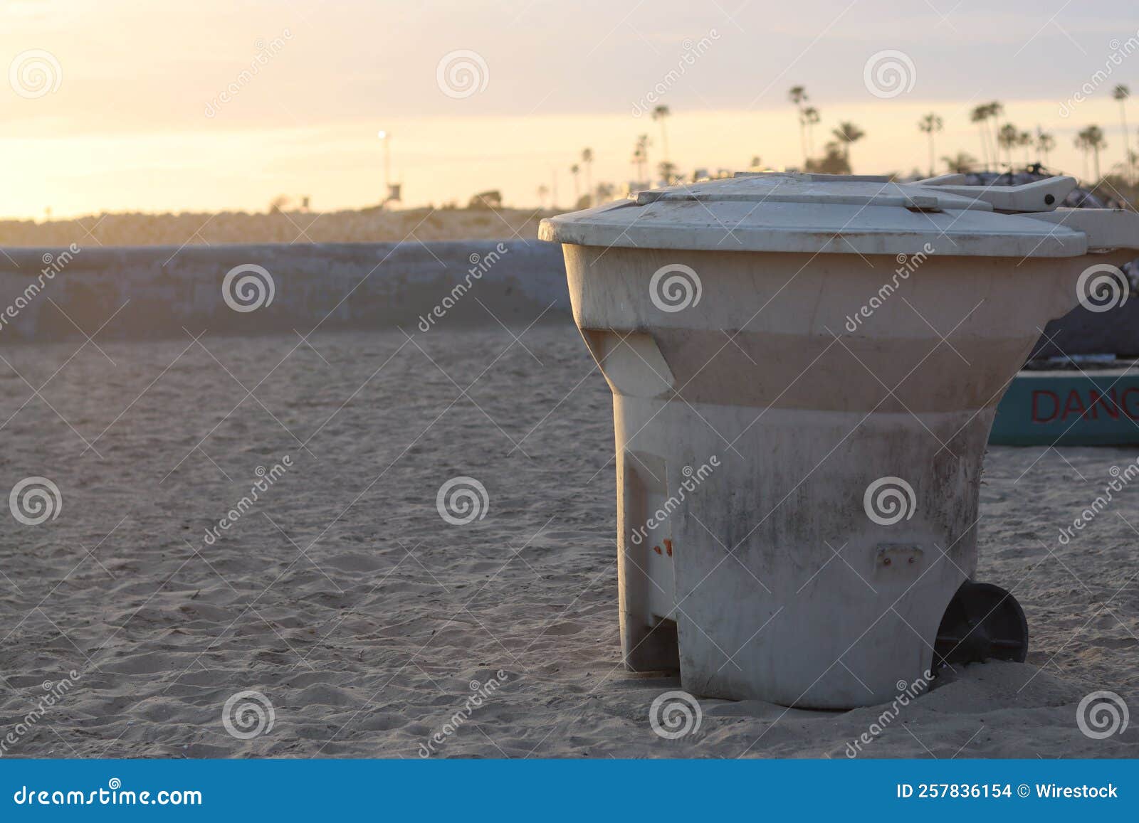 Closeup of a Plastic Recycle Bin on the Beach Sand Near the Ocean on a ...